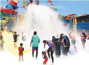 Many seeking a splashing good time - PressReader