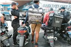 Judge pauses wage increase for food delivery workers in city - PressReader