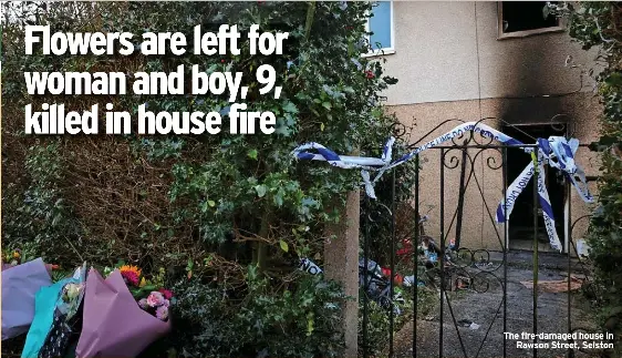 Nefwloswer­s are left for woman and boy, 9, killed in house fire ...