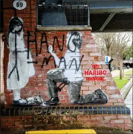 Upset as graffiti painted over popular street art - PressReader