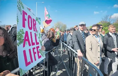 Police make 23 arrests as protesters disrupt start of the Grand ...