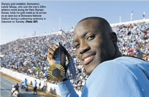 Flags and dancing as Botswana welcomes home Olympic hero - PressReader