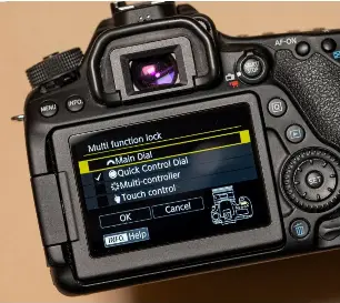 What is the lock switch on the back of the Canon EOS 90D used for, and ...