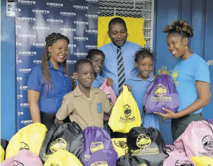 Clan Carthy students receive back-to-school support from Courts ...