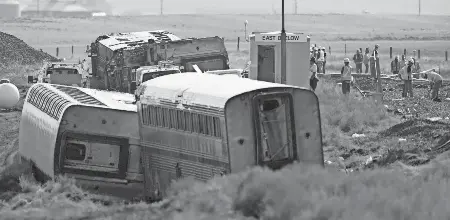 Investigat­ors looking at bent track in fatal Amtrak crash - PressReader