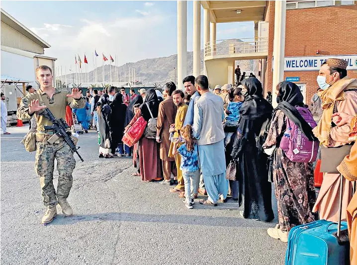 If you can’t take us, take our children, plead crowd outside Kabul ...