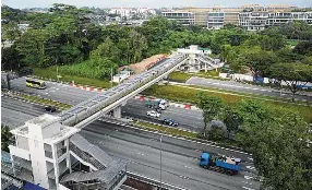 First cycling bridge in Jurong West lets residents walk, pedal across ...