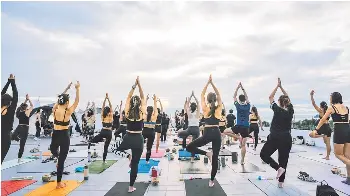 Over 100 partake in rooftop yoga and Pilates event - PressReader