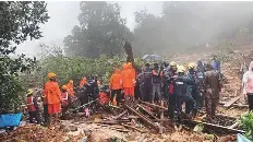 13 dead, many trapped after landslide buries an Indian village - PressReader