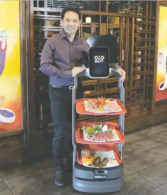 OMO Teppan and Kitchen's robot waiters usher in high-tech future ...