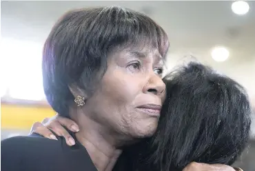 Retired Member of Parliament Portia Simpson Miller (left), with tear ...