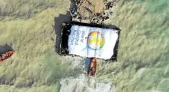 Aid boat unloads food in Gaza - PressReader