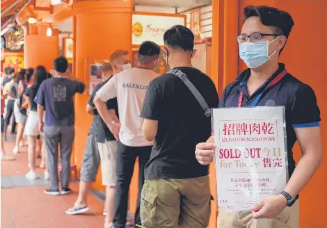 Long queue for bak kwa at Lim Chee Guan in Chinatown - PressReader