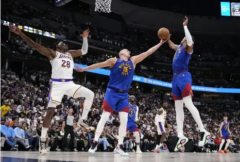 JOKIC LEADS NBA CHAMP NUGGETS PAST LEBRON, LAKERS IN PLAYOFF OPENER - PressReader