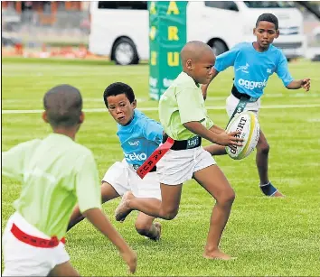 Keen action as U9s play tag rugby - PressReader