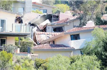 12 homes torn apart by landslide - PressReader
