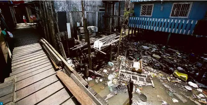 Famílias em Belém vivem sobre o lixo à espera de obra iniciada em 2006 - PressReader