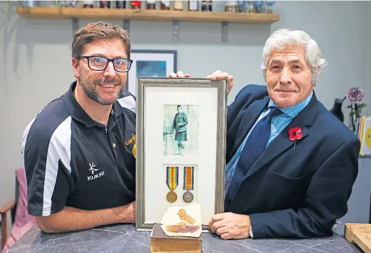 Ross Thomson and his father Alf with a poppy, medals and photo of Alf ...