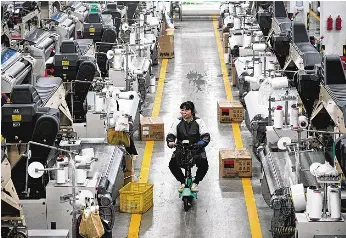 China factory activity expands for 3rd straight month but just barely - PressReader