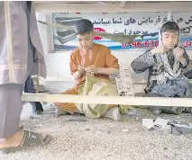 Afghan tailors outfit those celebratin­g Eid with gleaming garments - PressReader