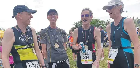 Smiles all round... triathlon is a big hit - PressReader