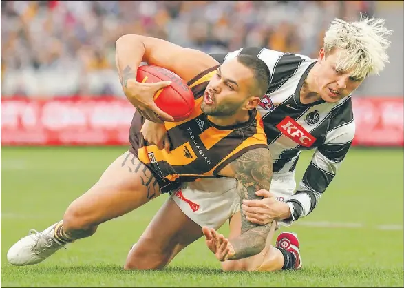Pies hold off Hawks to jump into top eight - PressReader