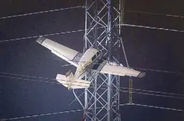 Crews rescue 2 in plane caught in power lines - PressReader