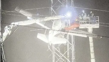 Pilot and passenger are rescued after plane gets tangled in high ...