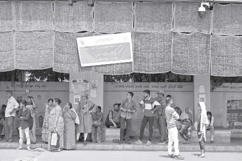 In one Indian city, reflective paint and bus stop sprinklers offer ...