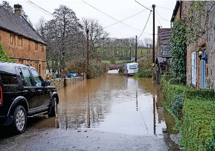 West braces for more flooding as rain persists - PressReader