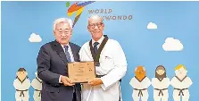 World Taekwondo awards FISU president honorary black belt - PressReader