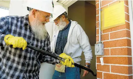 Volunteers fix homes as labor of love - PressReader
