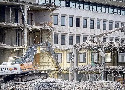 Building once occupied by hundreds of workers undergoing demolition ...