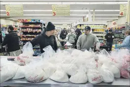 Families wait in line for hours to buy masa for Christmas tamales at ...