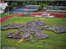 President Tharman joins 2,901 others to make human formation of scout ...