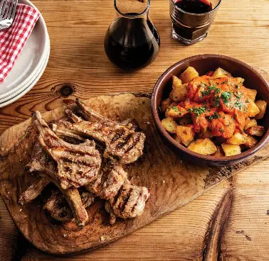 Smoky lamb chops with patatas bravas - PressReader